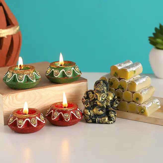 Buy/Send Antique Ganesha Idol & Diyas With Kaju Rolls Online- FNP