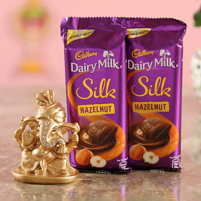 Buy/Send Dairy Milk Silk Hazelnut Chocolates & Beige Ganesha Idol ...