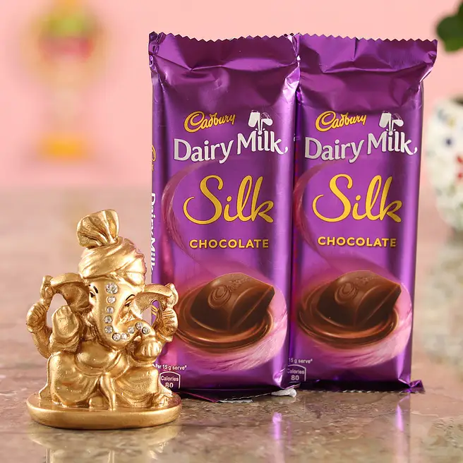 Buy/Send Two Dairy Milk Silk Chocolates & Beige Ganesha Idol Combo ...