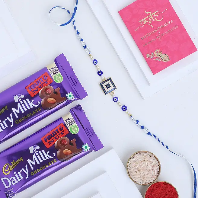 Buy/Send Protective Evil Eye Rakhi & Fruit N Nut Bars Online- FNP