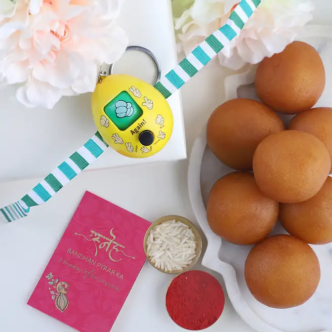 Buy/Send Sneh Kids Push Button Rakhi with Gulab Jamun Online- FNP