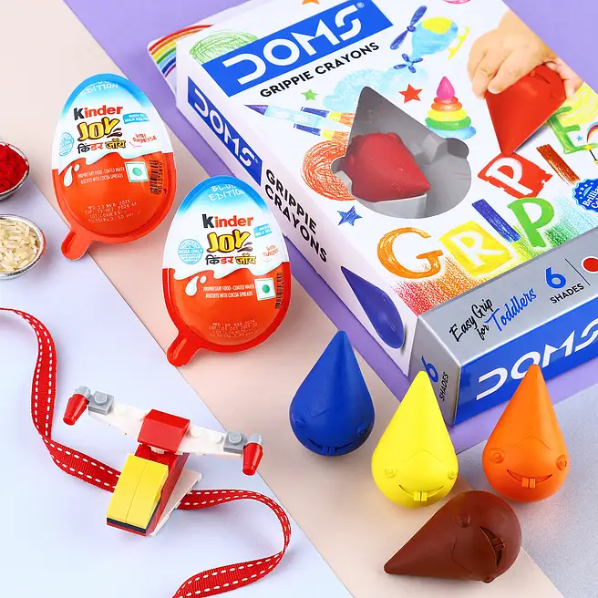 Buy/Send Aviator Lego Rakhi & Doms Crayon Sweet Combo Online- FNP