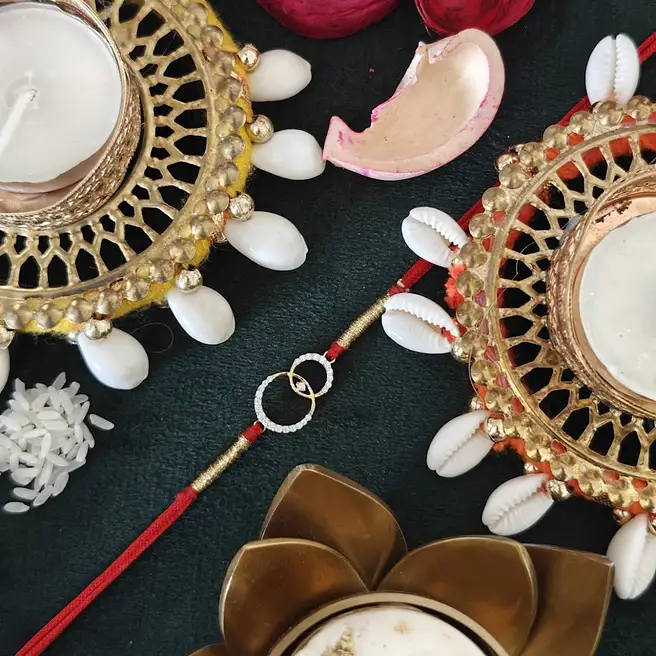 Buy/Send 9k Gold Circle of Love Forever Rakhi Online- FNP