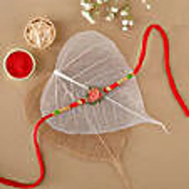Sneh Exclusive Om Leaf Rakhi usa | Gift Sneh Exclusive Om Leaf Rakhi- FNP